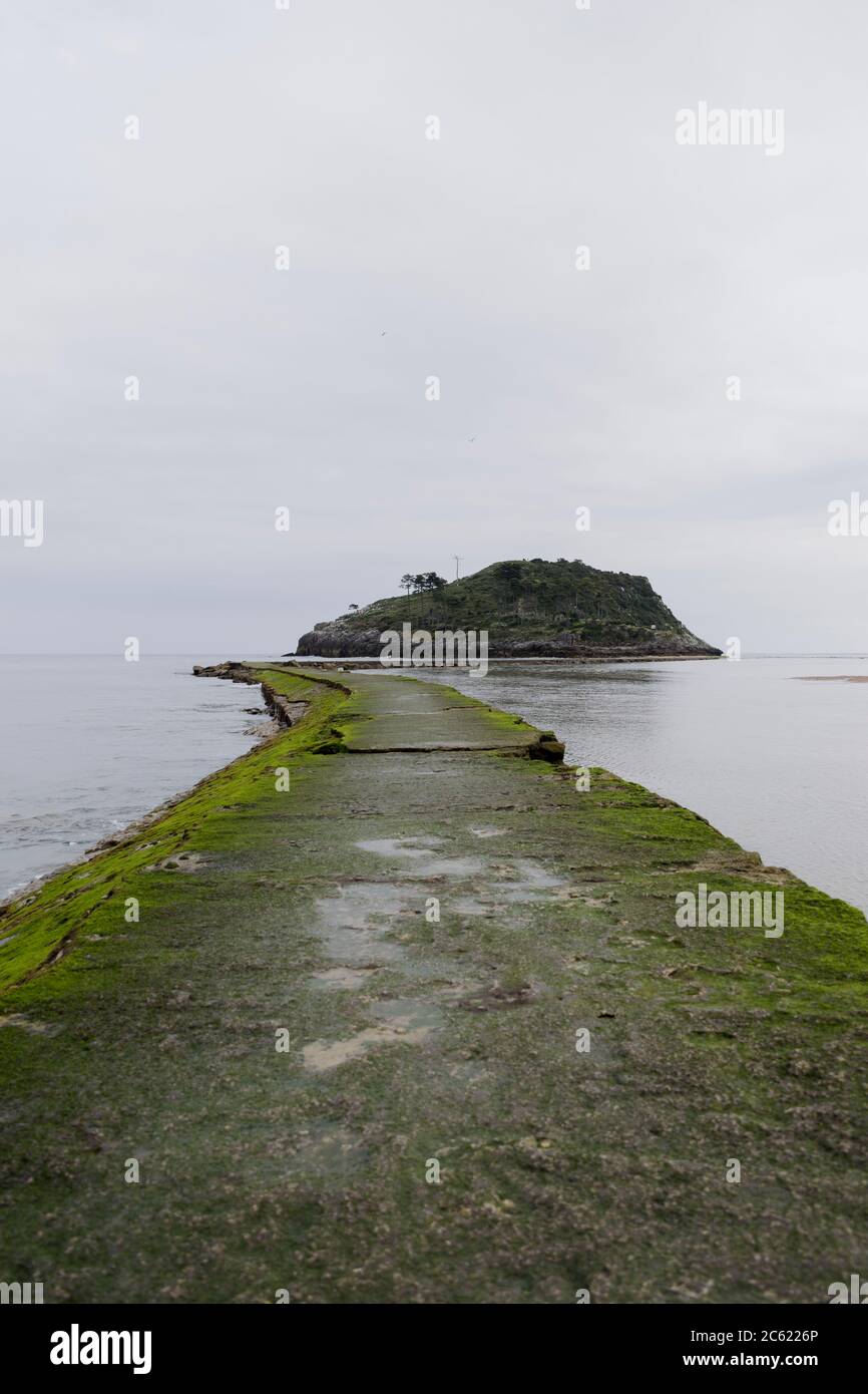 Empty road to a small island Stock Photo - Alamy