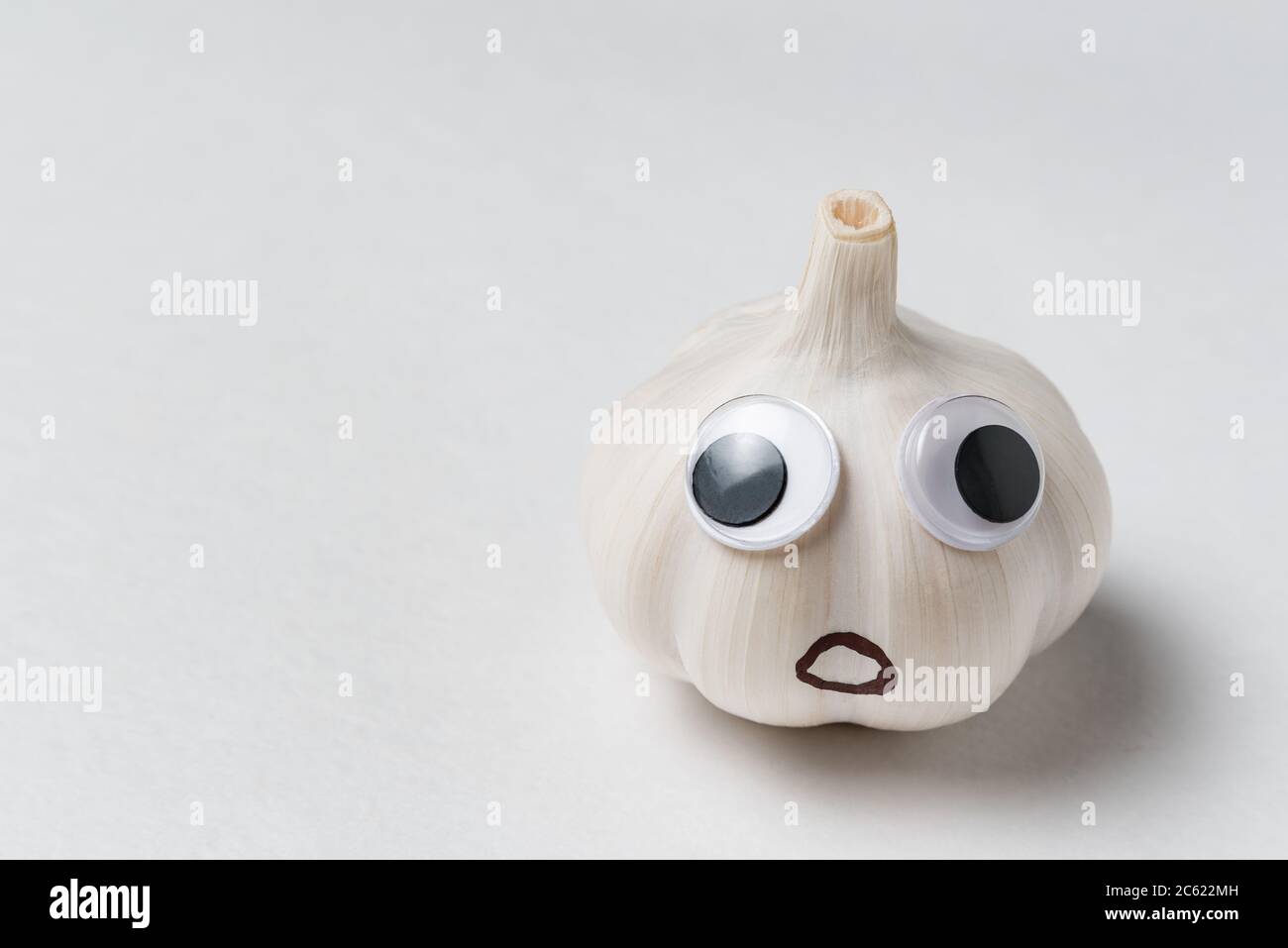 garlic character. Garlic with Googly eyes and funny face on white ...