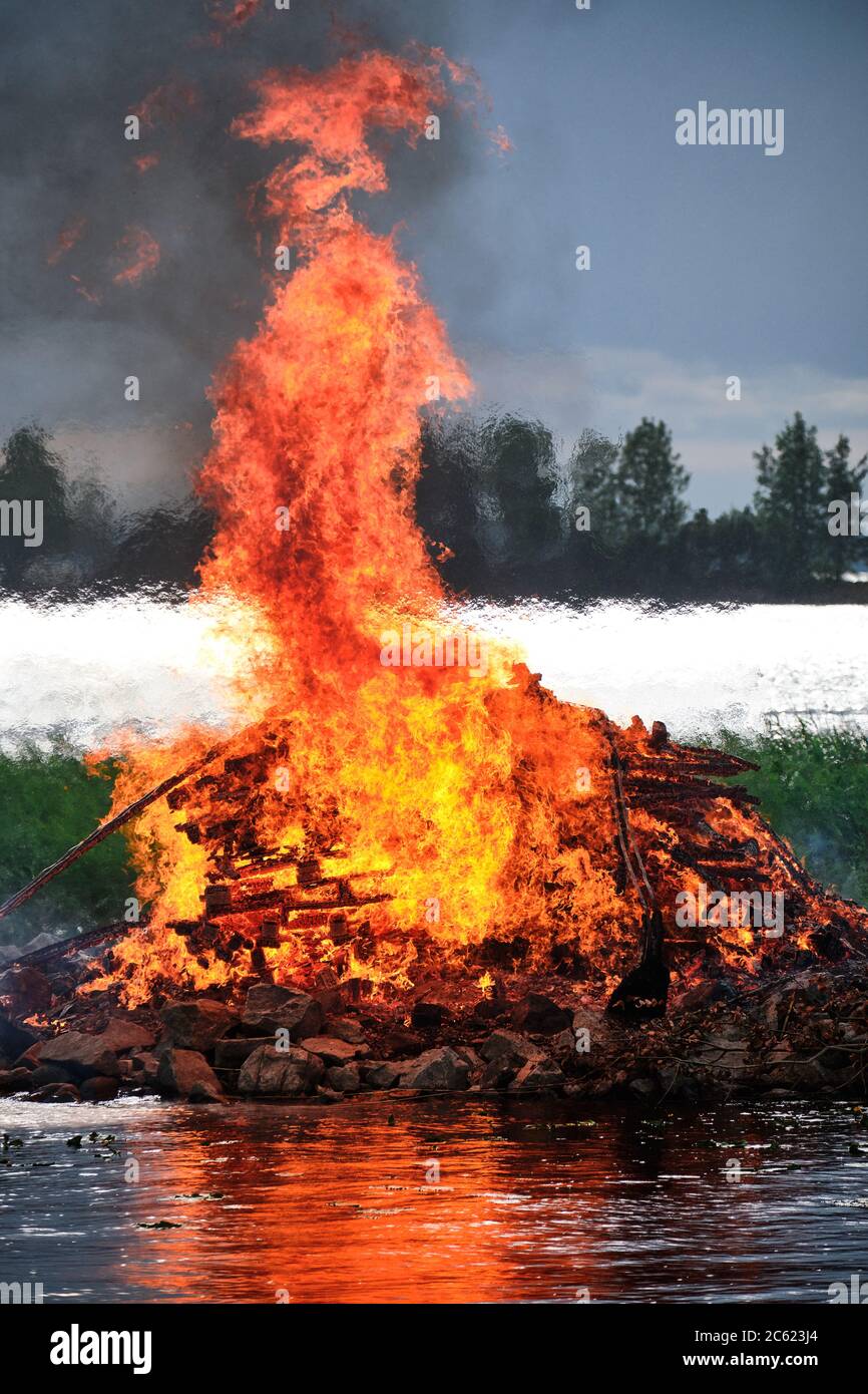 Midsummer bonfire. Traditional Finnish celebration Juhannus Stock Photo ...