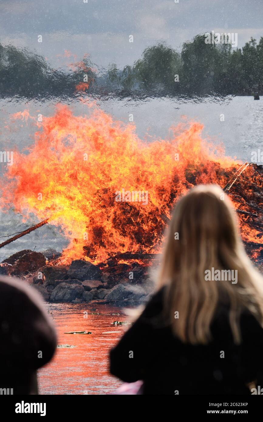 Midsummer bonfire. Traditional Finnish celebration Juhannus Stock Photo ...