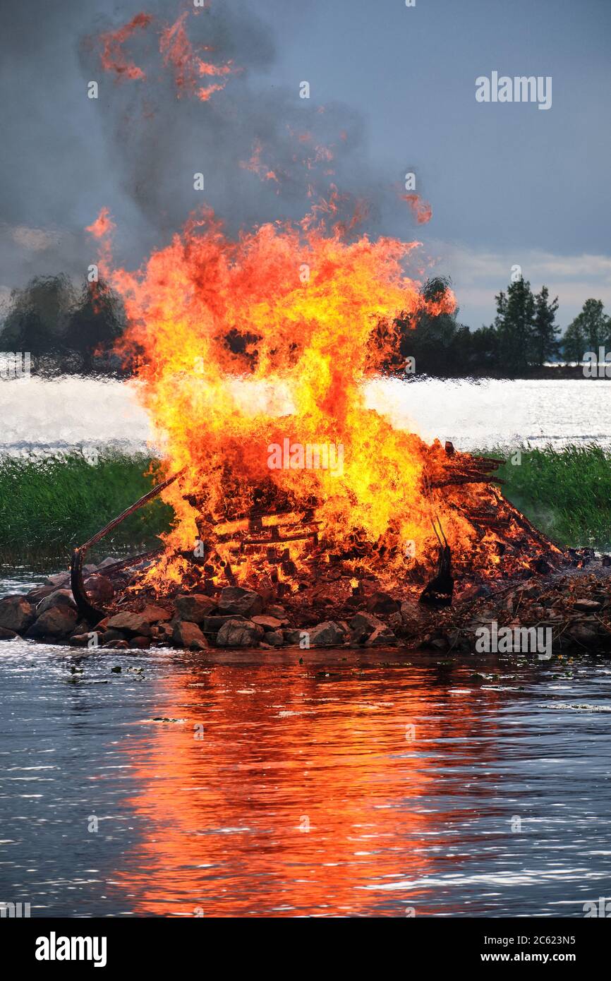 Midsummer bonfire. Traditional Finnish celebration Juhannus Stock Photo ...