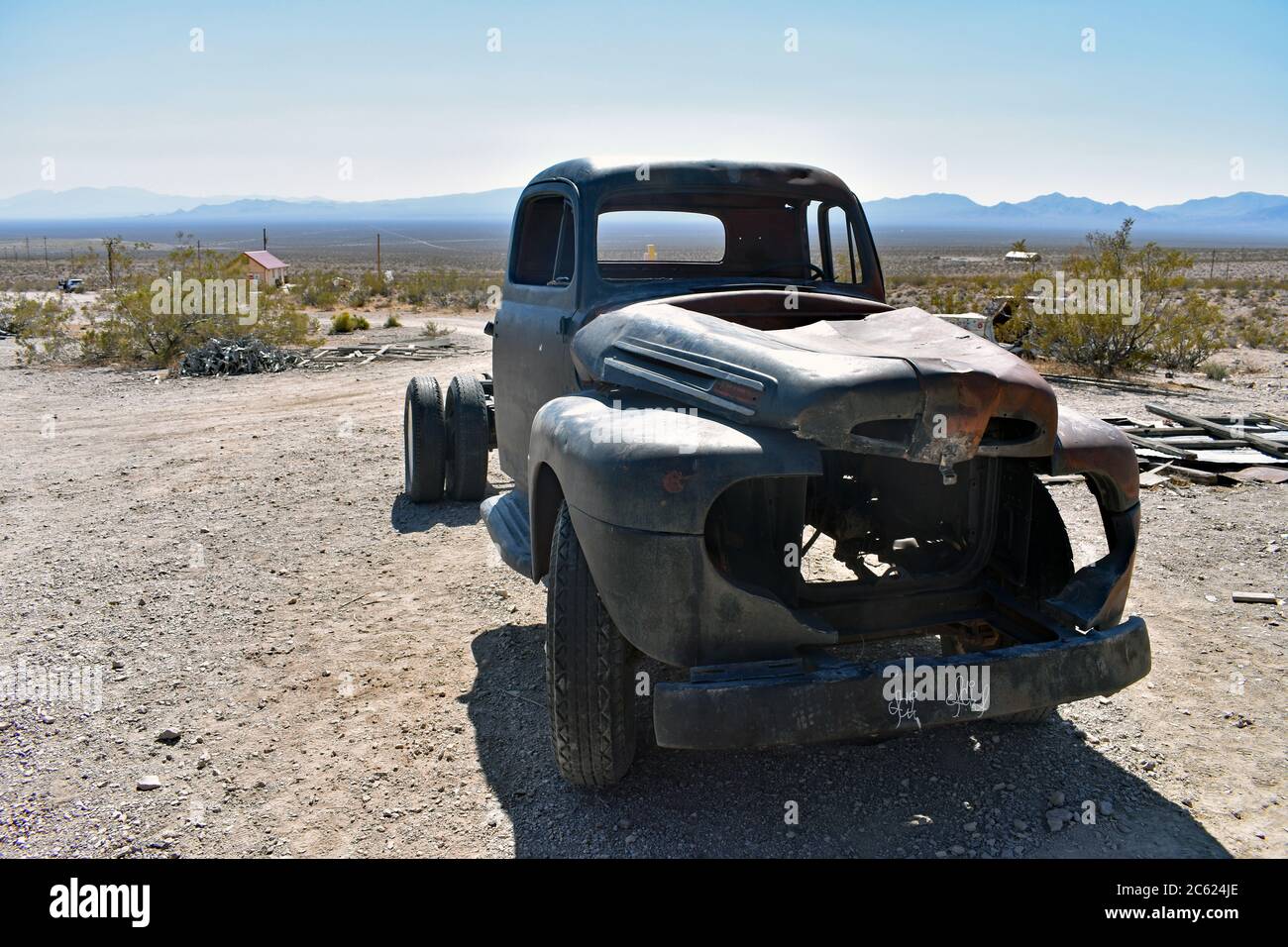An abandoned pick up truck / vehicle in the Nevada desert with ...