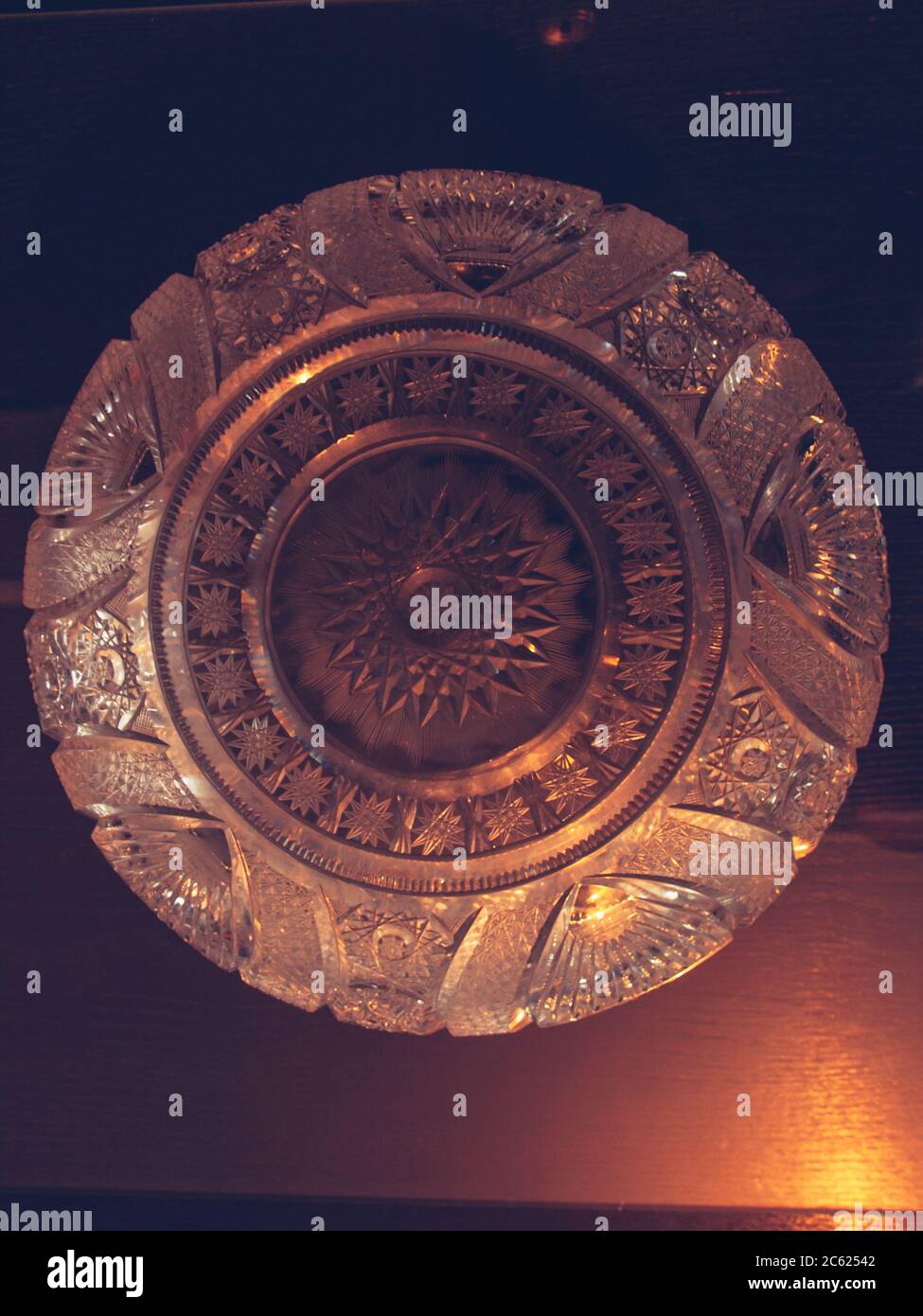 The empty classic crystal vase with reflection on a black background ...