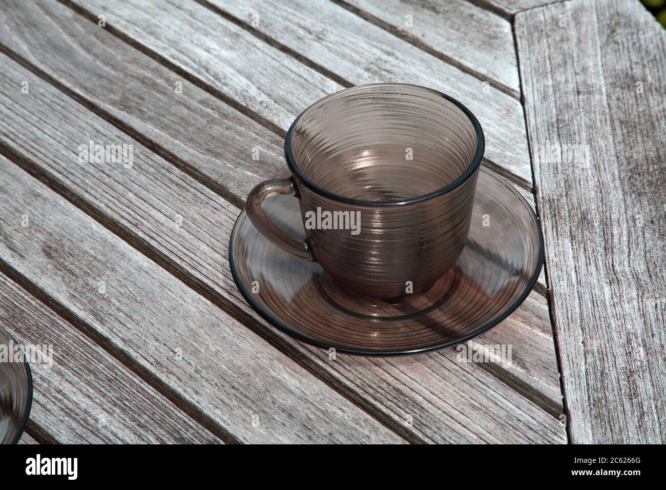 Vintage Smoke Coloured French Glass Cup And Saucers Stock Photo - Alamy