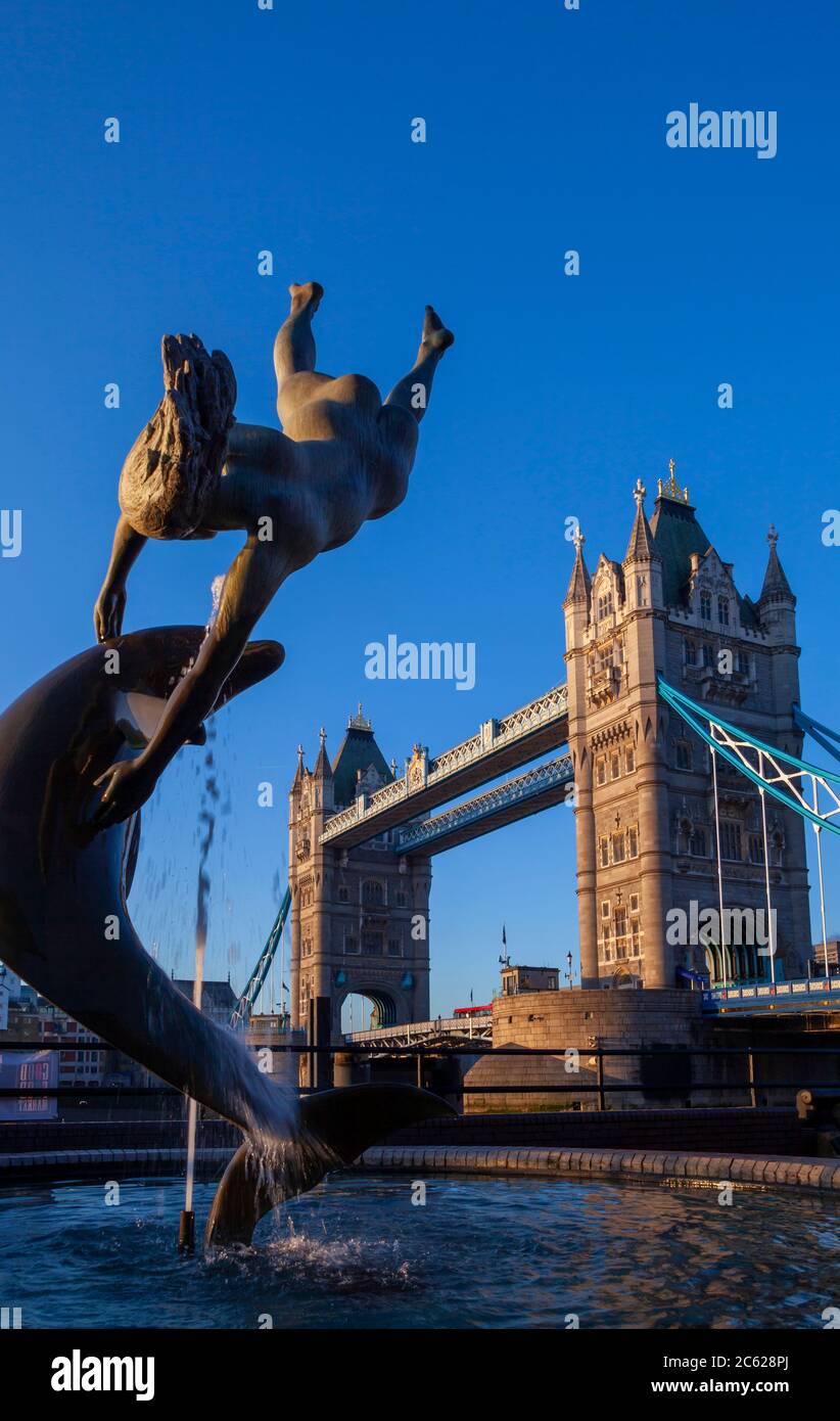 Girl with a Dolphin and Tower Bridge, London, England Stock Photo - Alamy