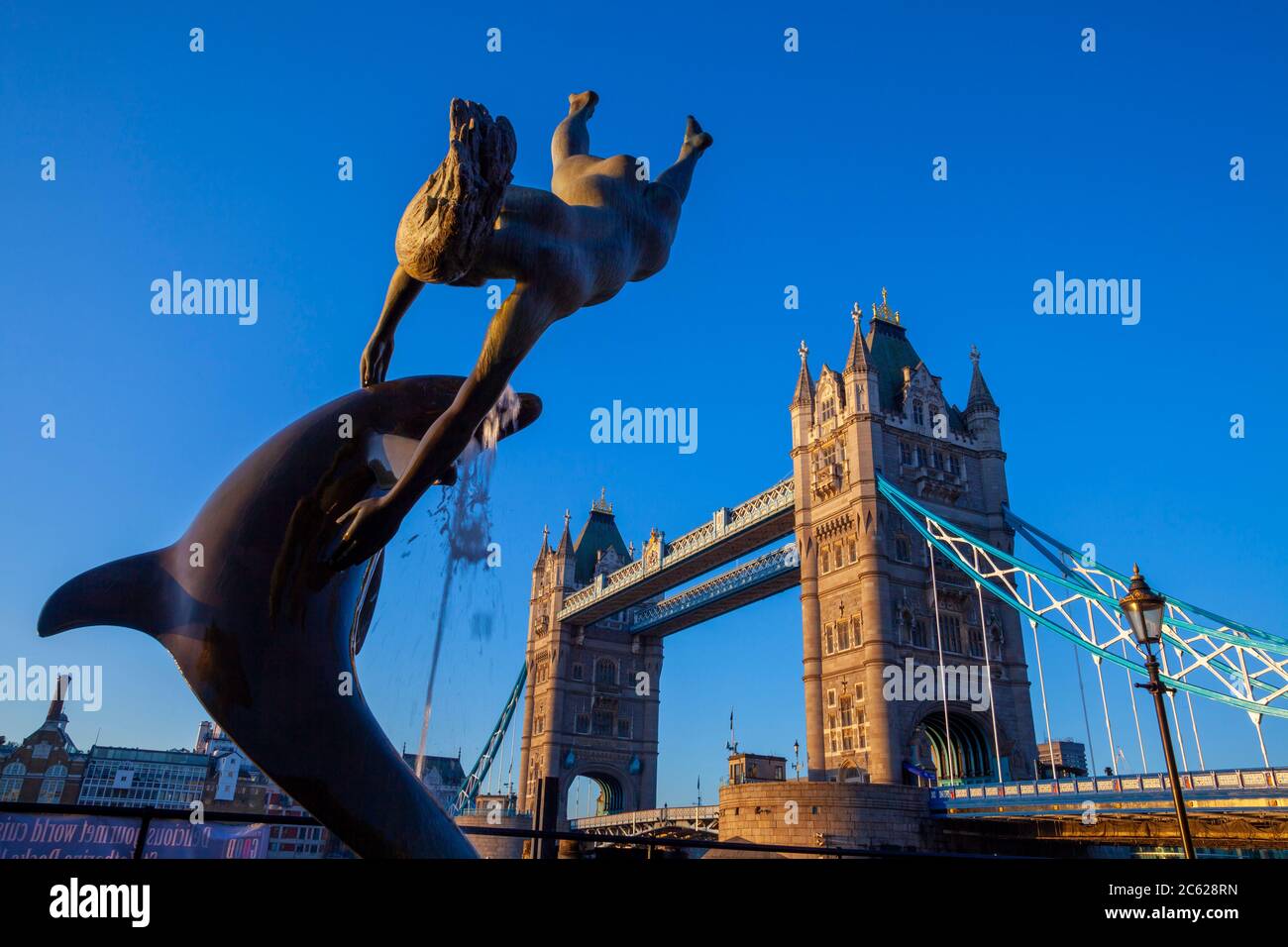 Girl with a Dolphin and Tower Bridge, London, England Stock Photo - Alamy