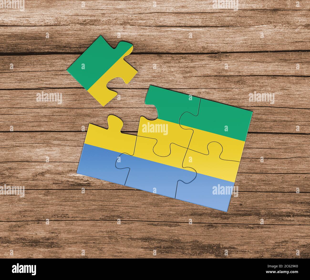 Gabon national flag on jigsaw puzzle. One piece is missing. Danger ...