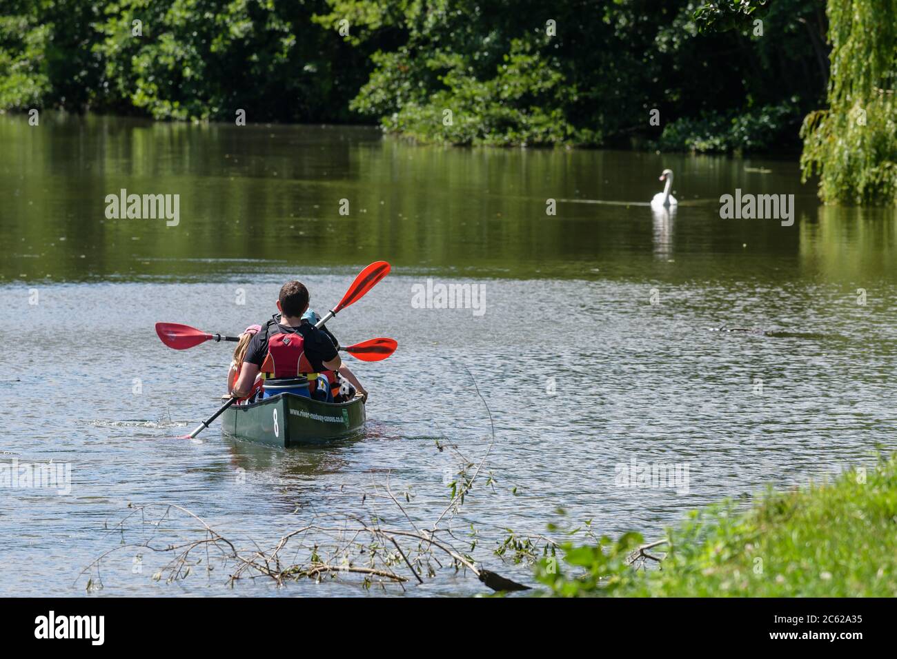 Family in their rowing boat hi-res stock photography and images - Alamy