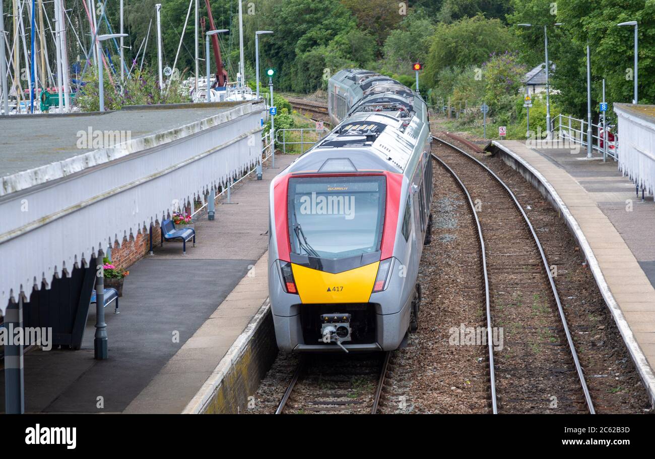 British Rail Class 755 Stadler bi-modal train leaving railway station ...