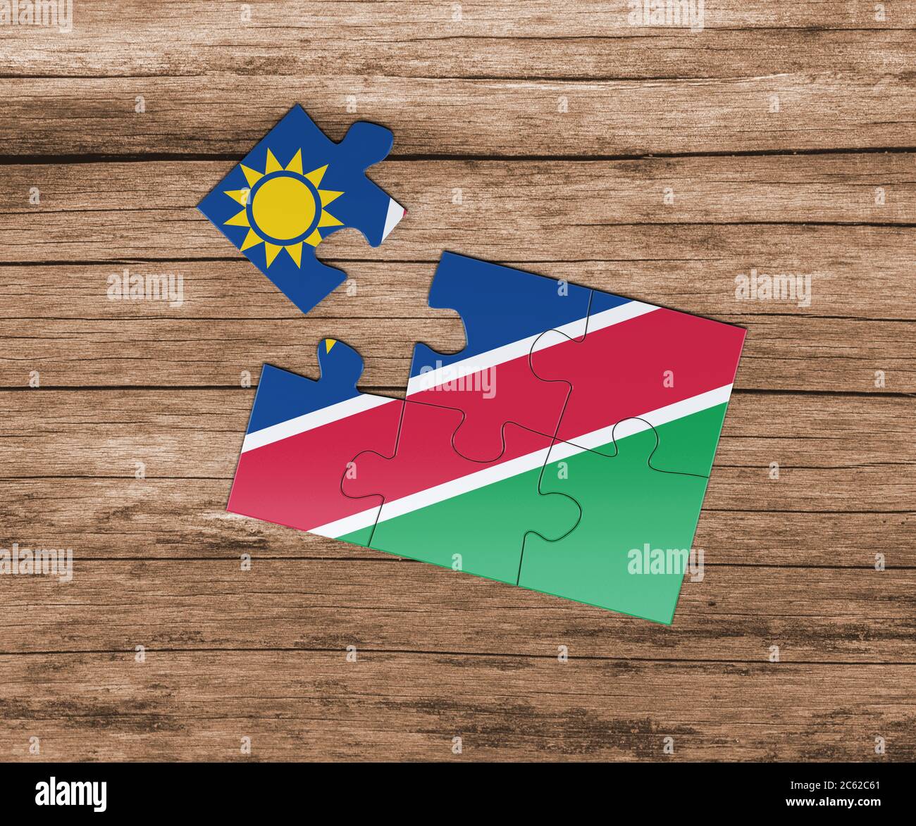 Namibia national flag on jigsaw puzzle. One piece is missing. Danger ...