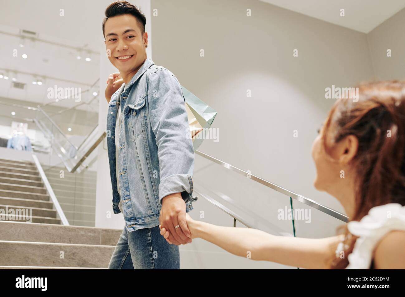 Holding hands walking up stairs hi-res stock photography and images - Alamy