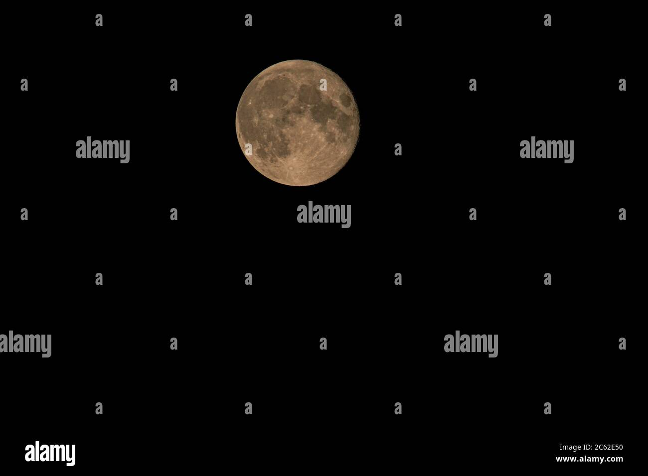 The full moon moves through the night sky Stock Photo - Alamy