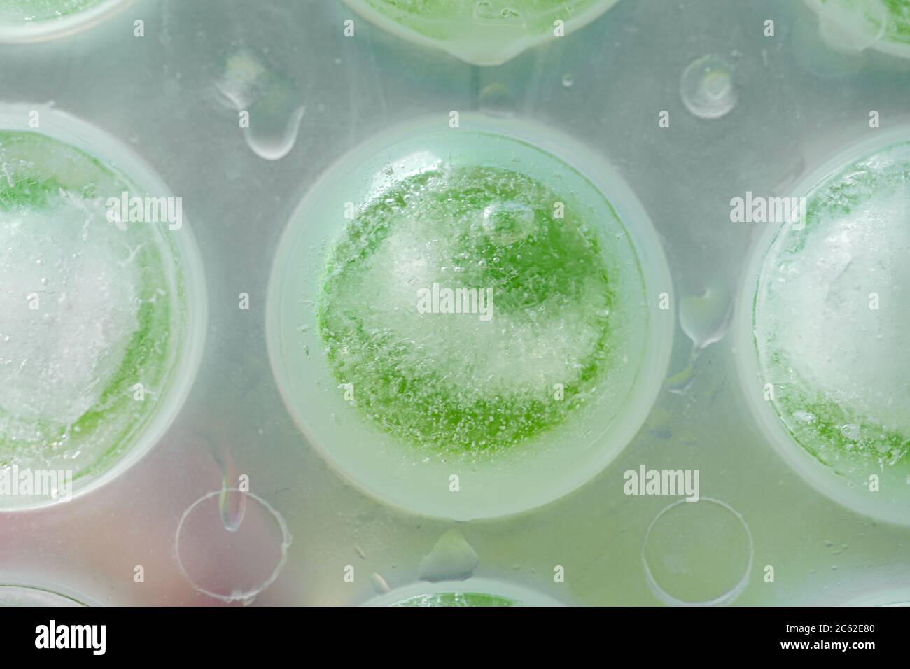 water (ice cube) frozen in ice mold Stock Photo - Alamy