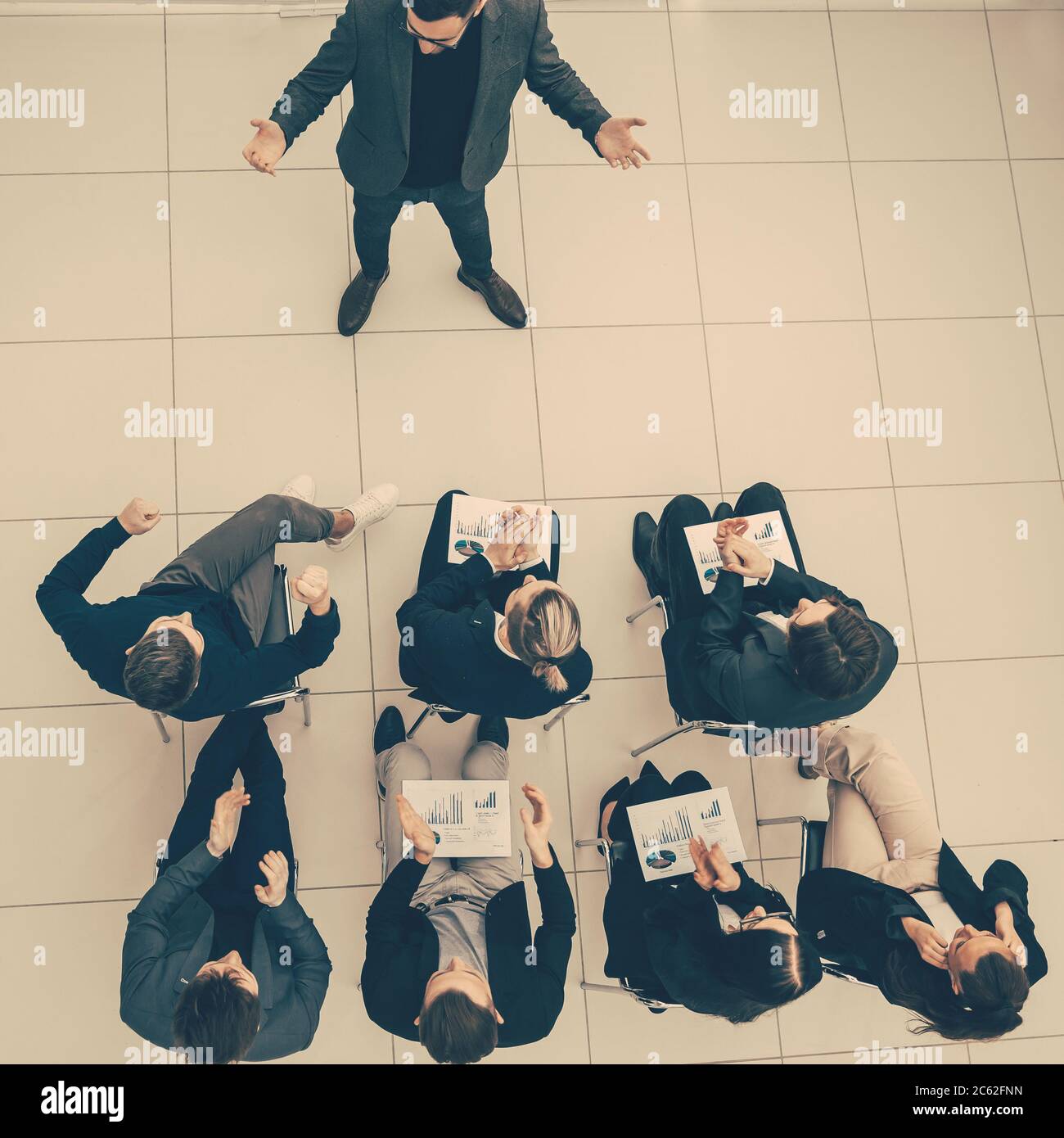 top view. group of employees applauding at a work meeting Stock Photo ...