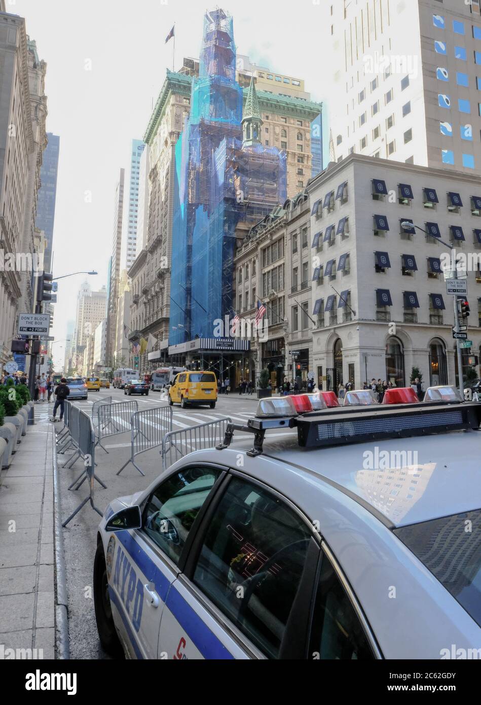 Parked NYPD vehicle sen parked next to the out of view Trump Tower in ...