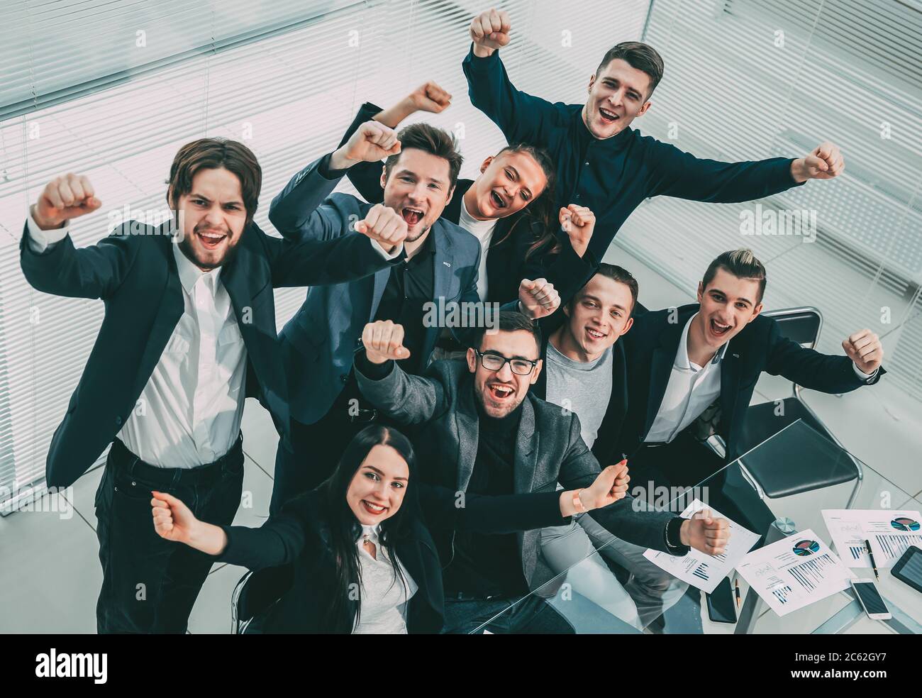happy business team at the workplace in the office Stock Photo - Alamy