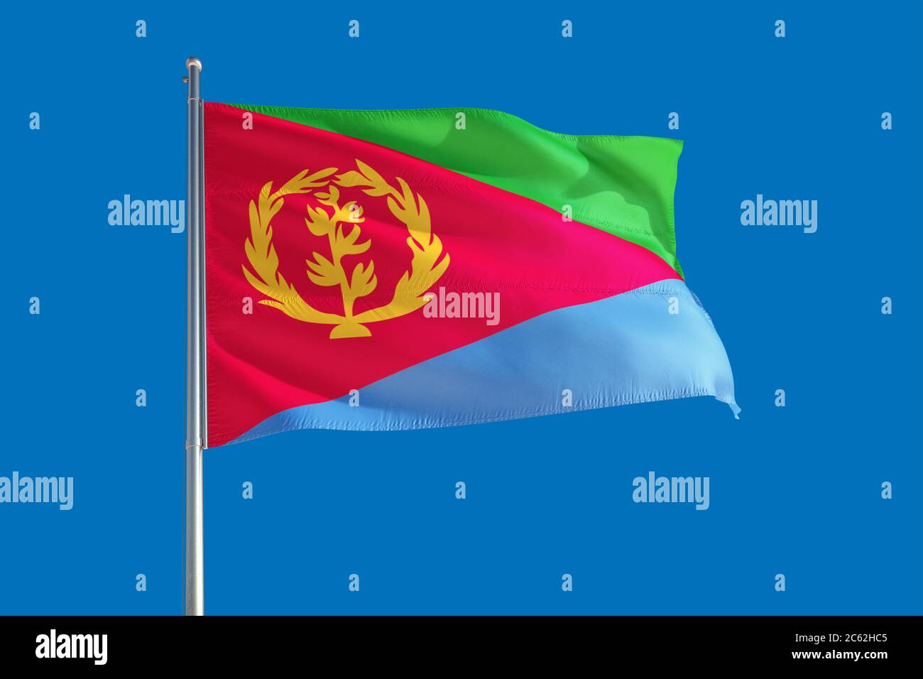 Eritrea national flag waving in the wind on a deep blue sky. High ...