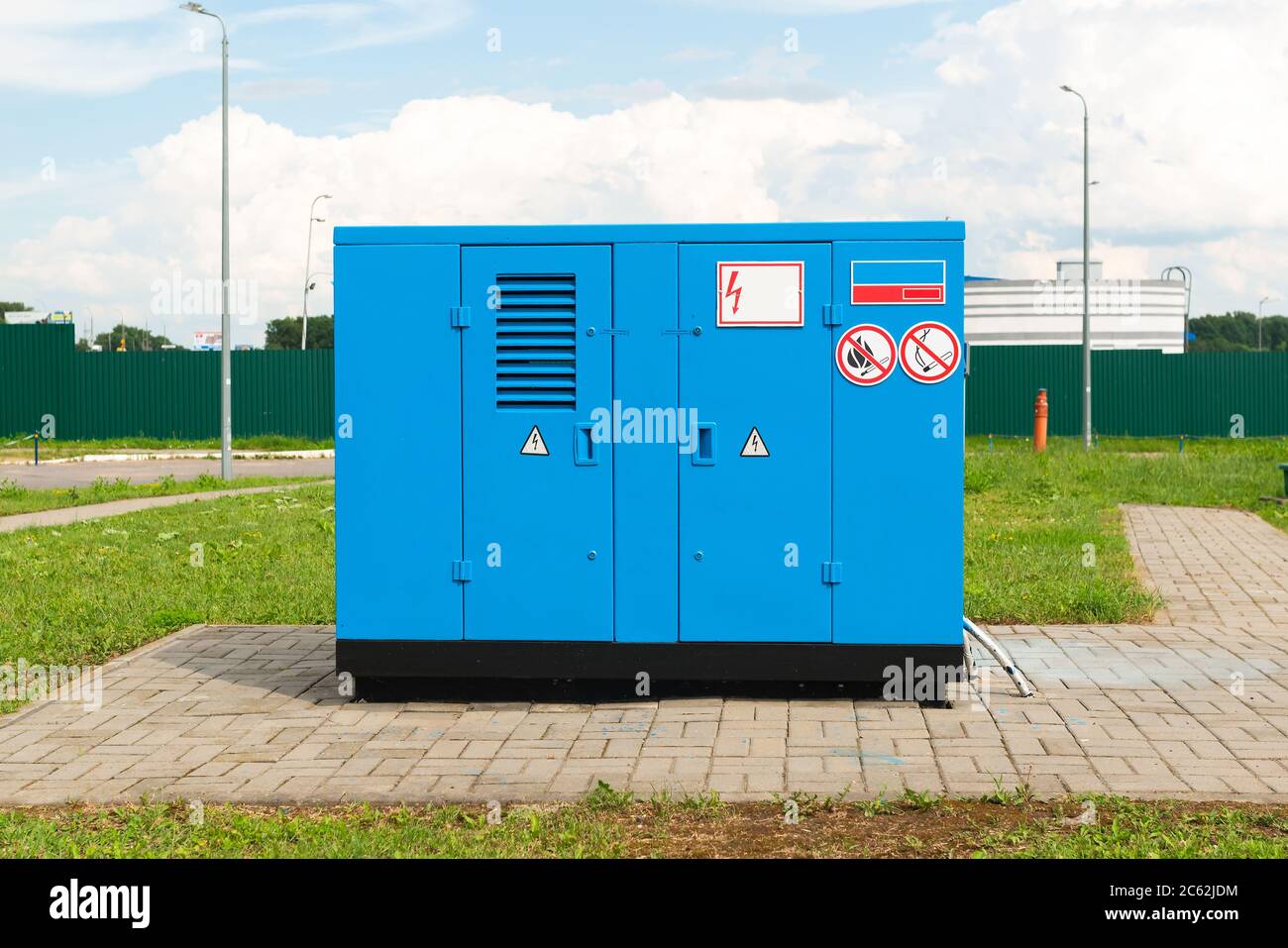 Outdoor emergency power generator with blue housing and special signs ...