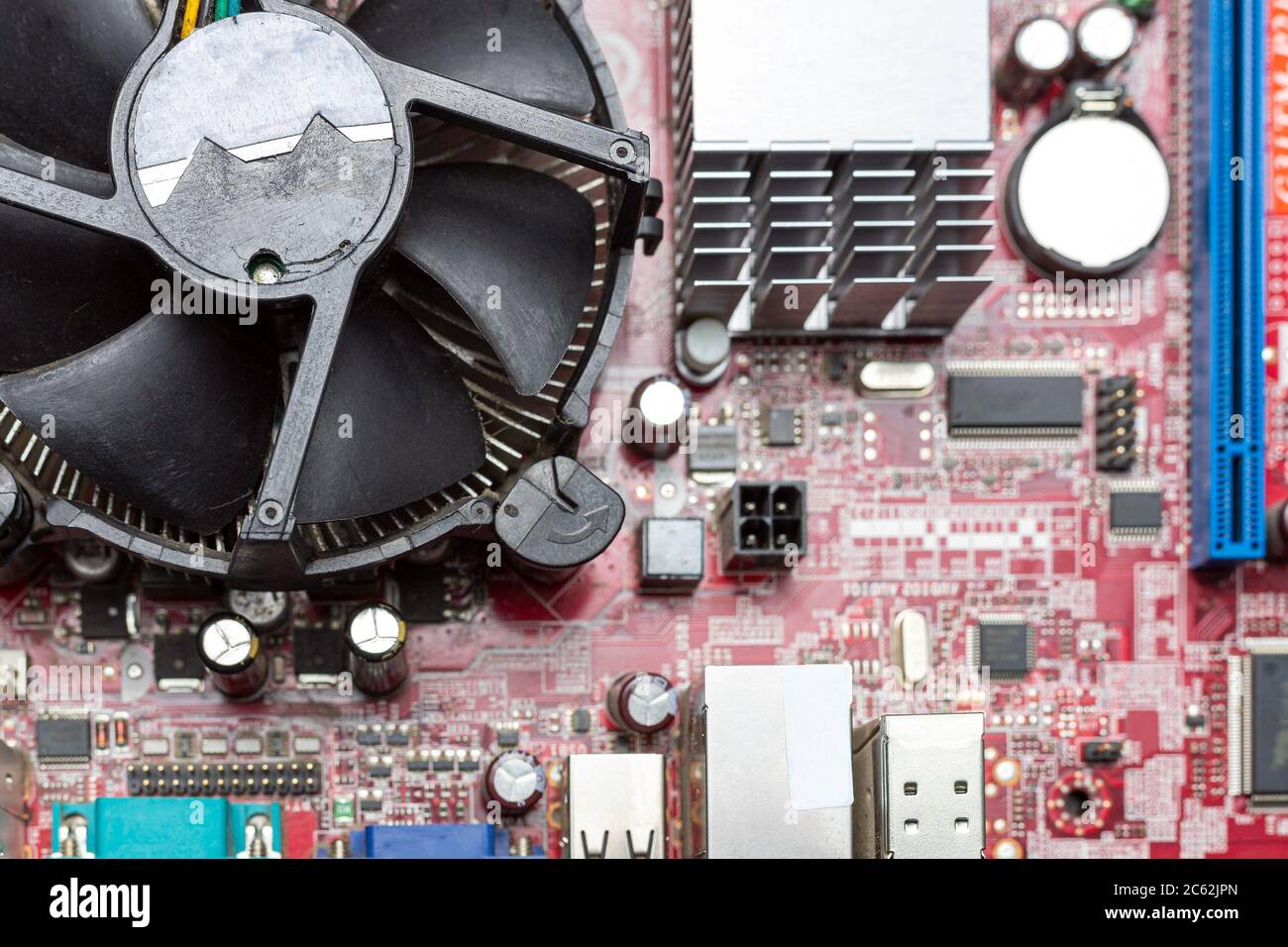Close-up view of the motherboard of computer with PCU cooler. Top view ...