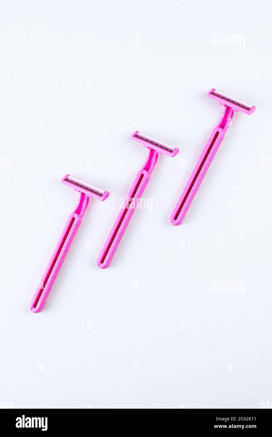 Pink disposable razor Stock Photo - Alamy
