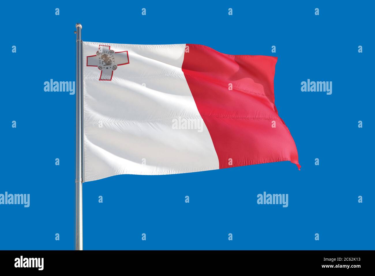 Malta national flag waving in the wind on a deep blue sky. High quality ...