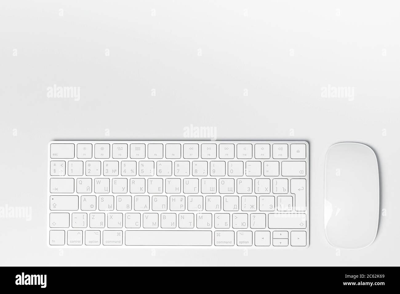 Office white desk with keyboard and mouse. Top view with copy space ...