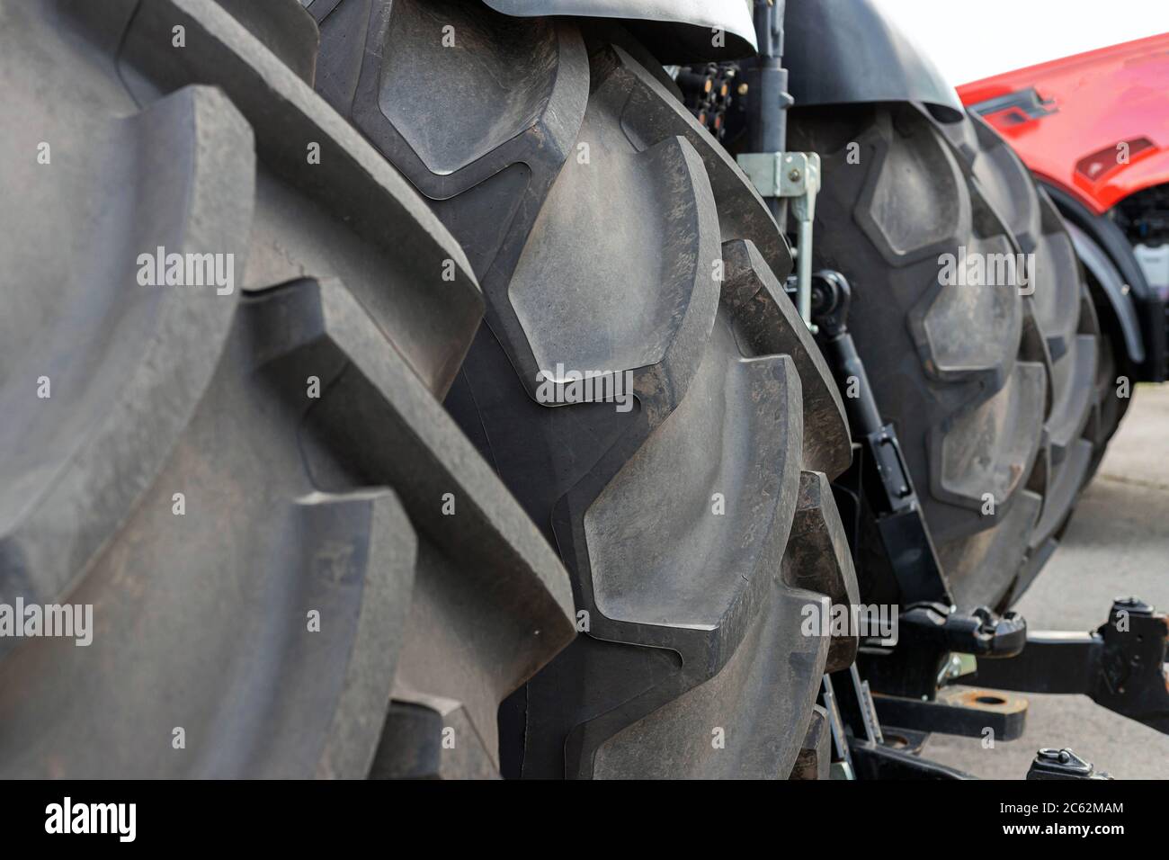 A few huge wheels from a tractor or agricultural machinery close-up ...