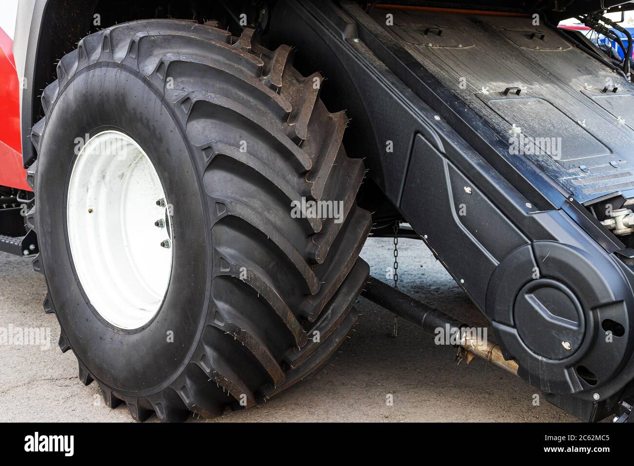 Image of the front of the combine. Wheel of large agricultural ...