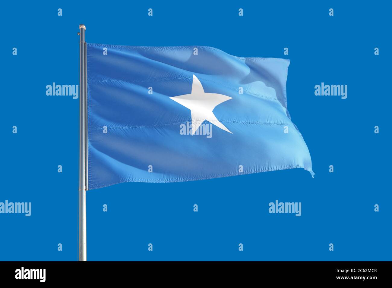 Somalia national flag waving in the wind on a deep blue sky. High ...