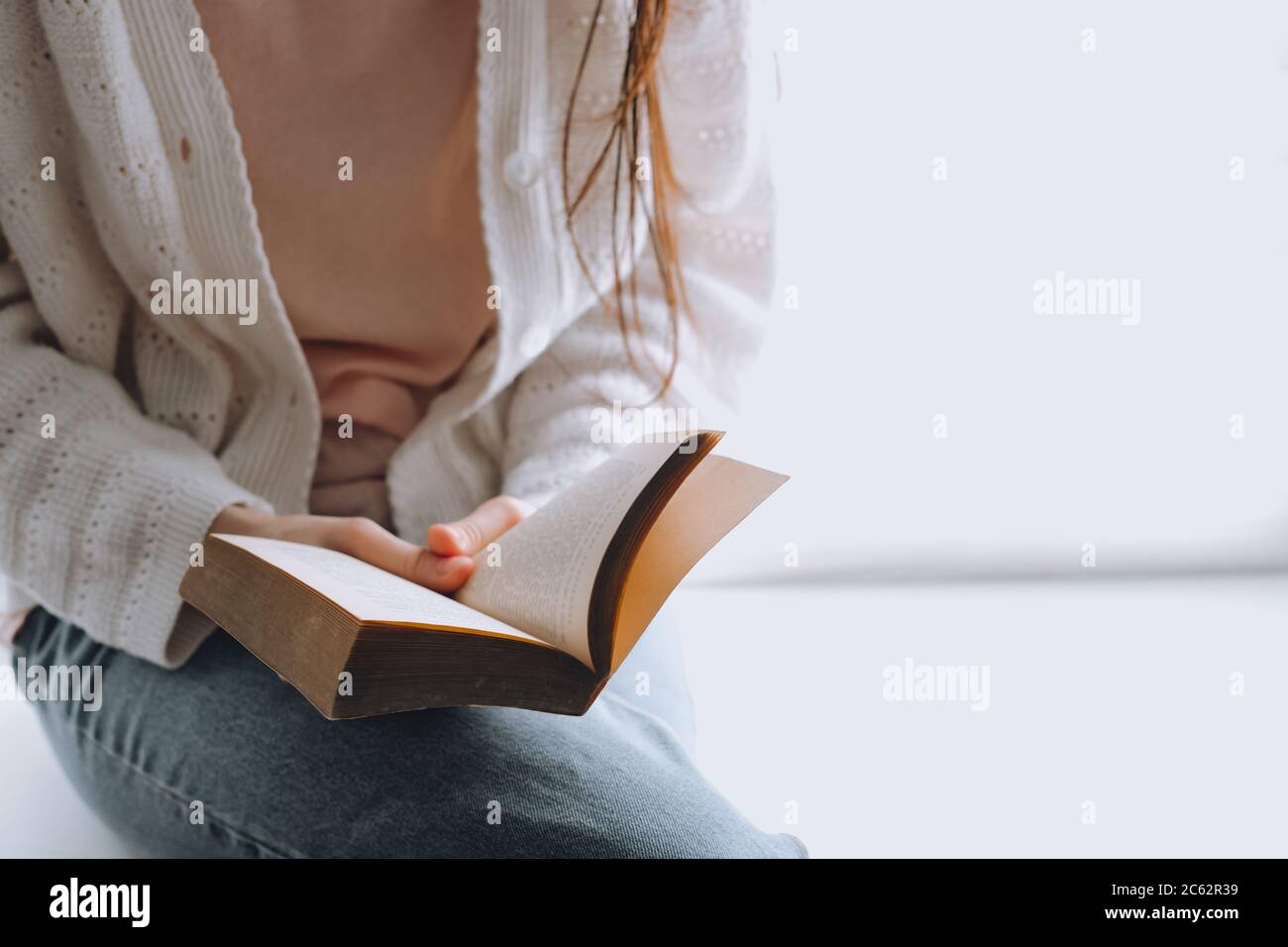 Woman reads a book Stock Photo - Alamy