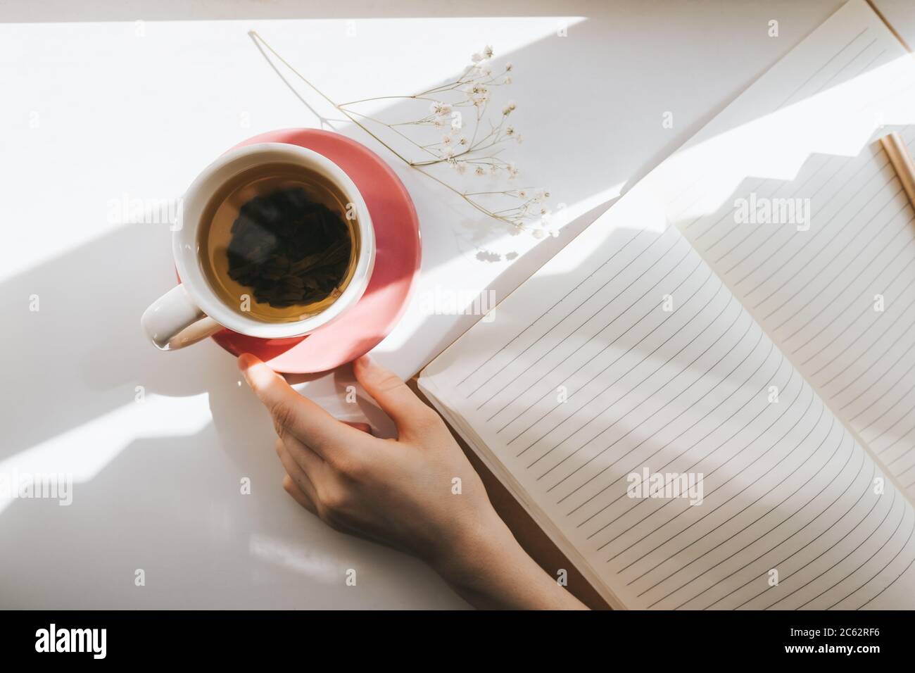 Woman hand takes cup coffee hi-res stock photography and images - Alamy