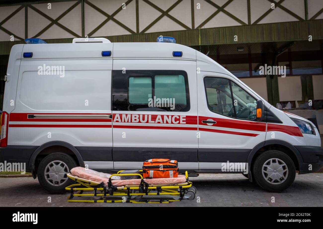 Paramedics emergency rescue team's stretcher and ambulance car is ready ...
