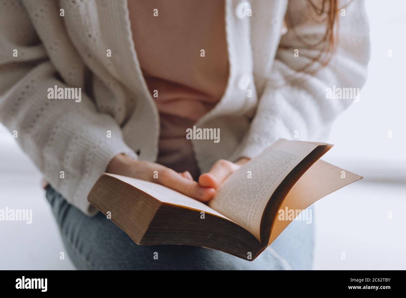 Woman reads a book Stock Photo - Alamy