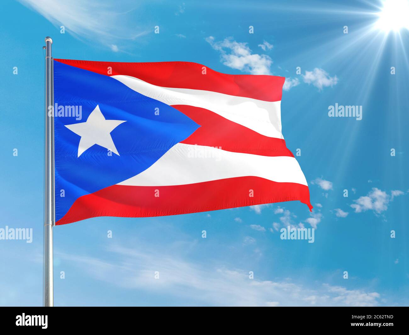 Puerto Rico national flag waving in the wind against deep blue sky ...
