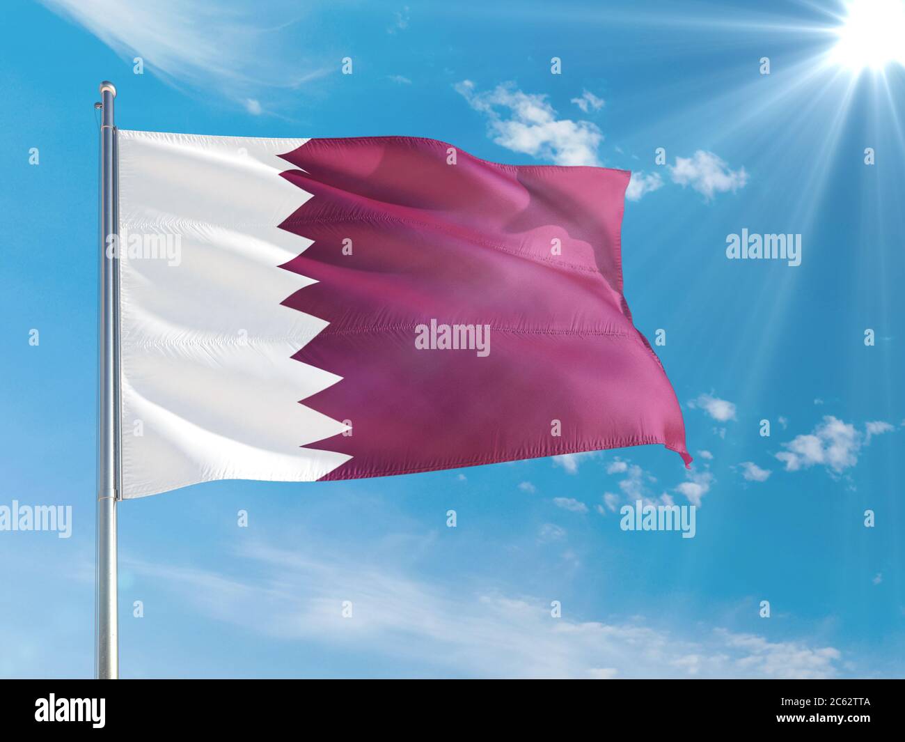 Qatar national flag waving in the wind against deep blue sky. High ...