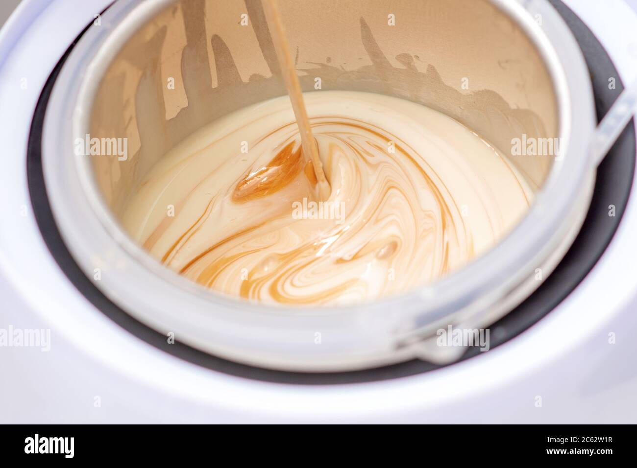 Electric wax warmer or wax heater with melted wax during heating inside ...