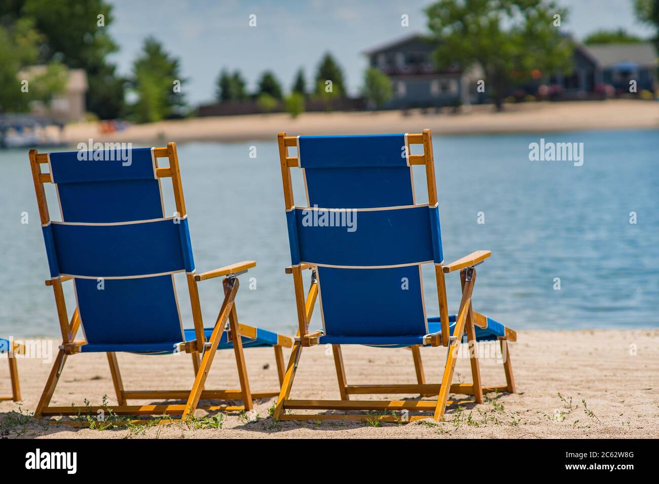 Two beach chairs overlooking lake Stock Photo - Alamy