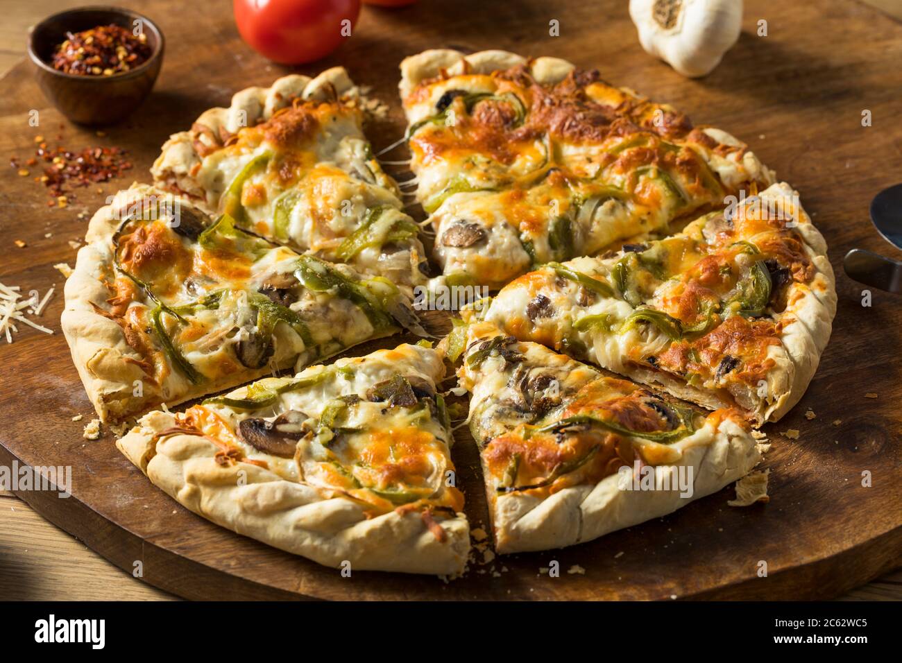 Homemade Vegeterian Supreme Pizza with Mushrooms and Peppers Stock ...
