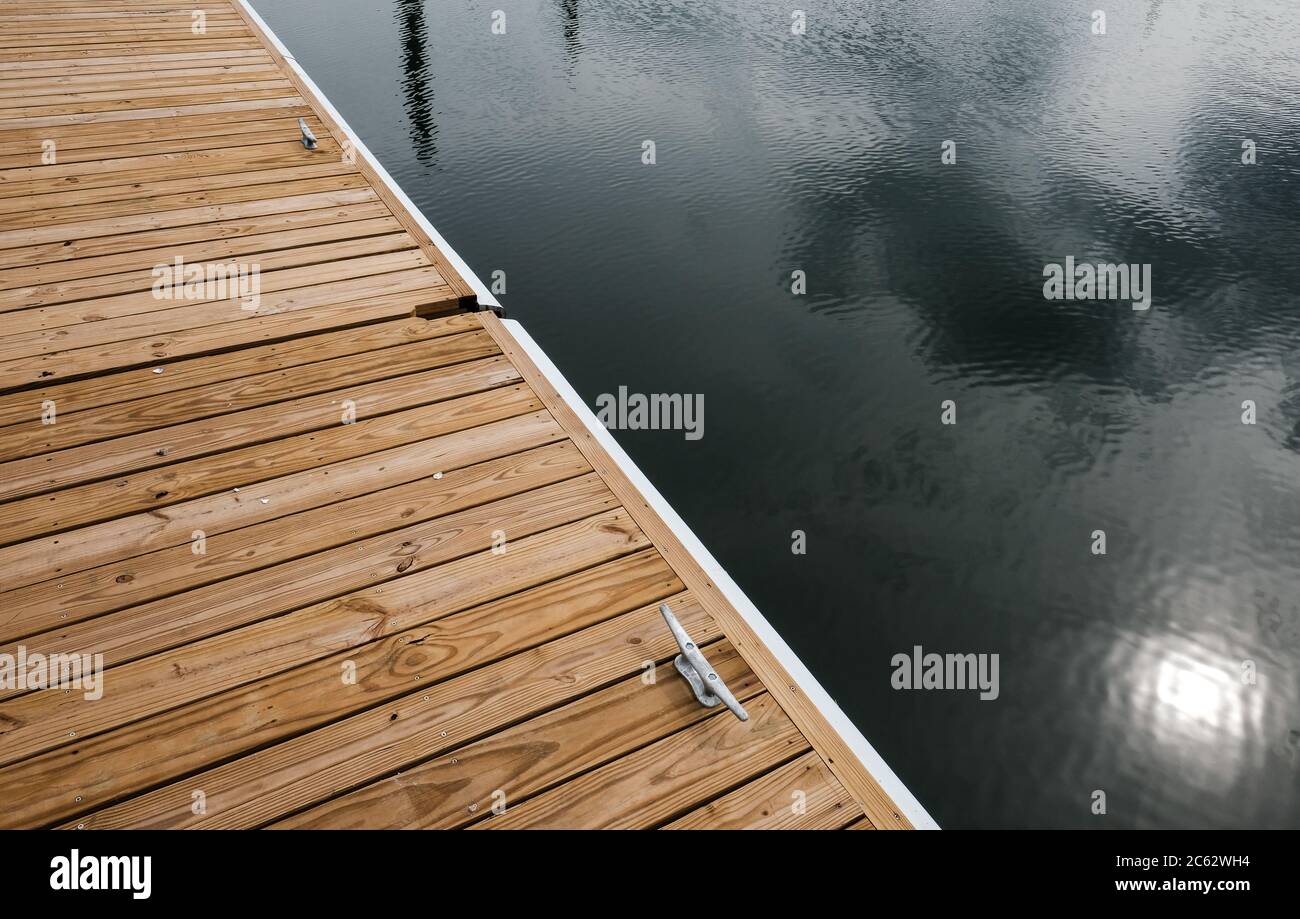 Newly installed timber built jetty seen on a harbour in a North ...