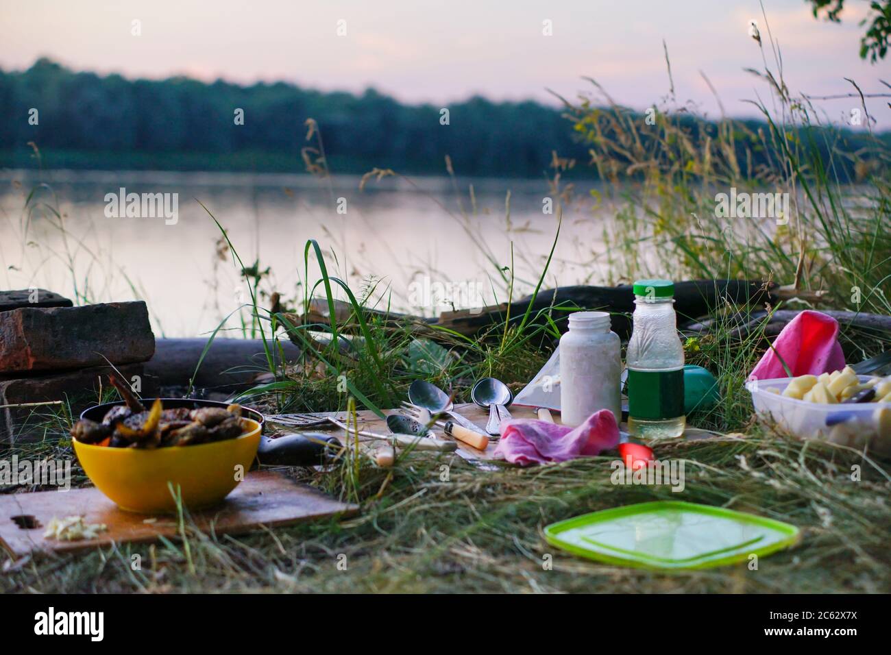 cooked baked fish in a plate by the river Stock Photo - Alamy