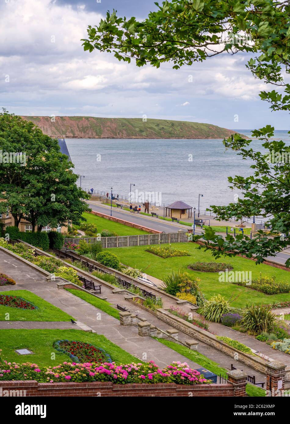 A view of the bay at Filey. Public gardens are in the foreground ...