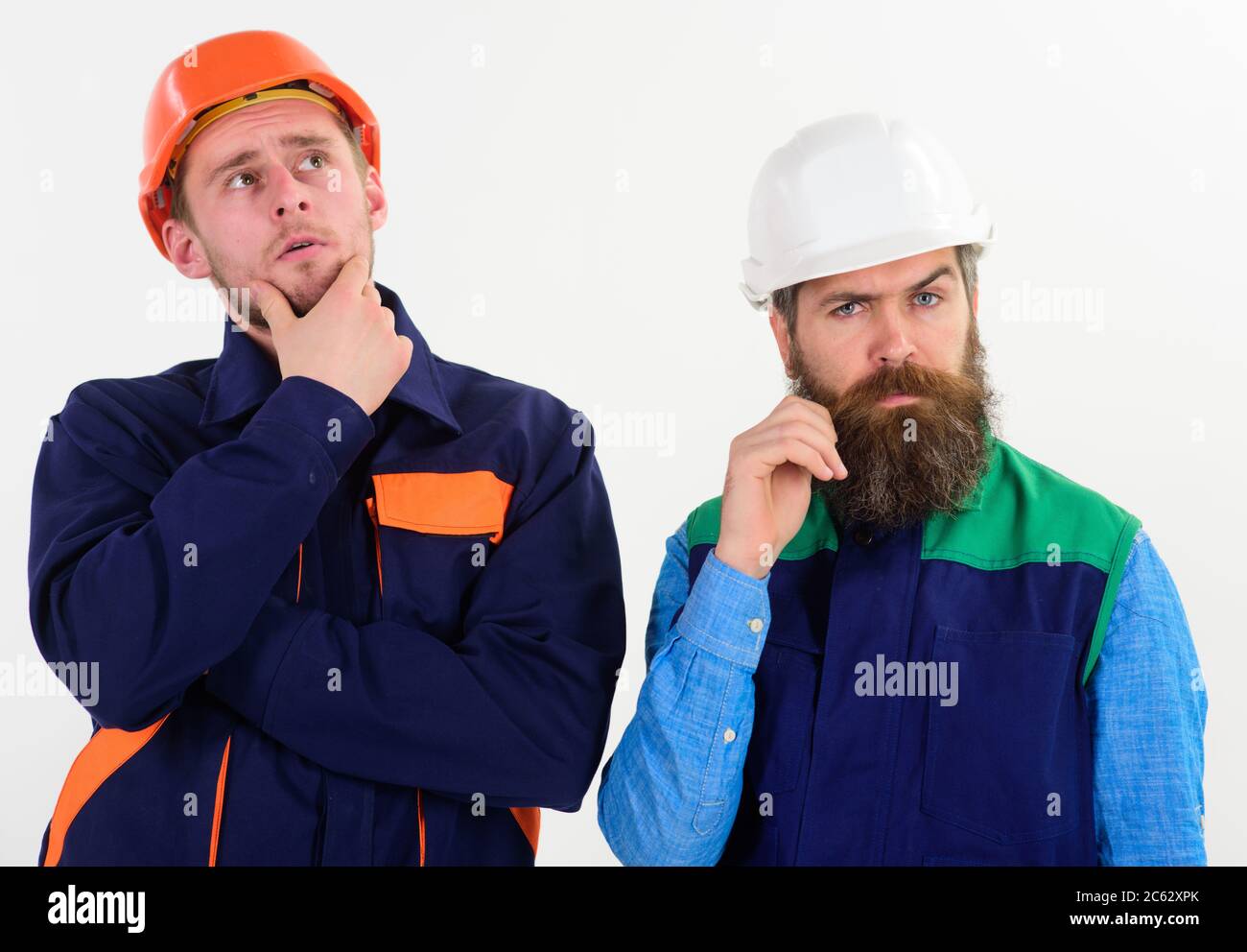 First think then do concept. Men in hard hats and uniform, builders ...