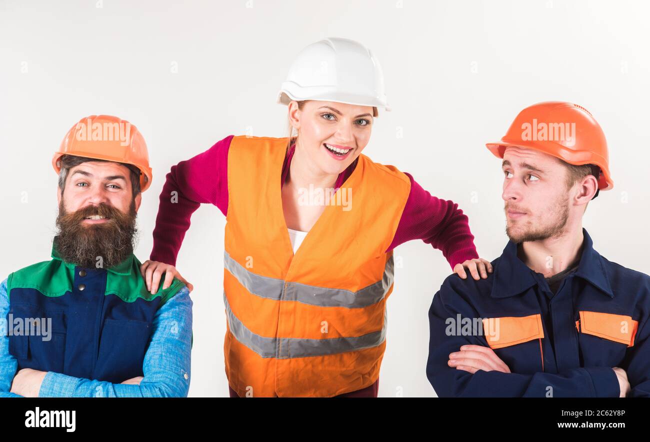 Teamwork concept. Men and woman in helmets with smiling faces white ...
