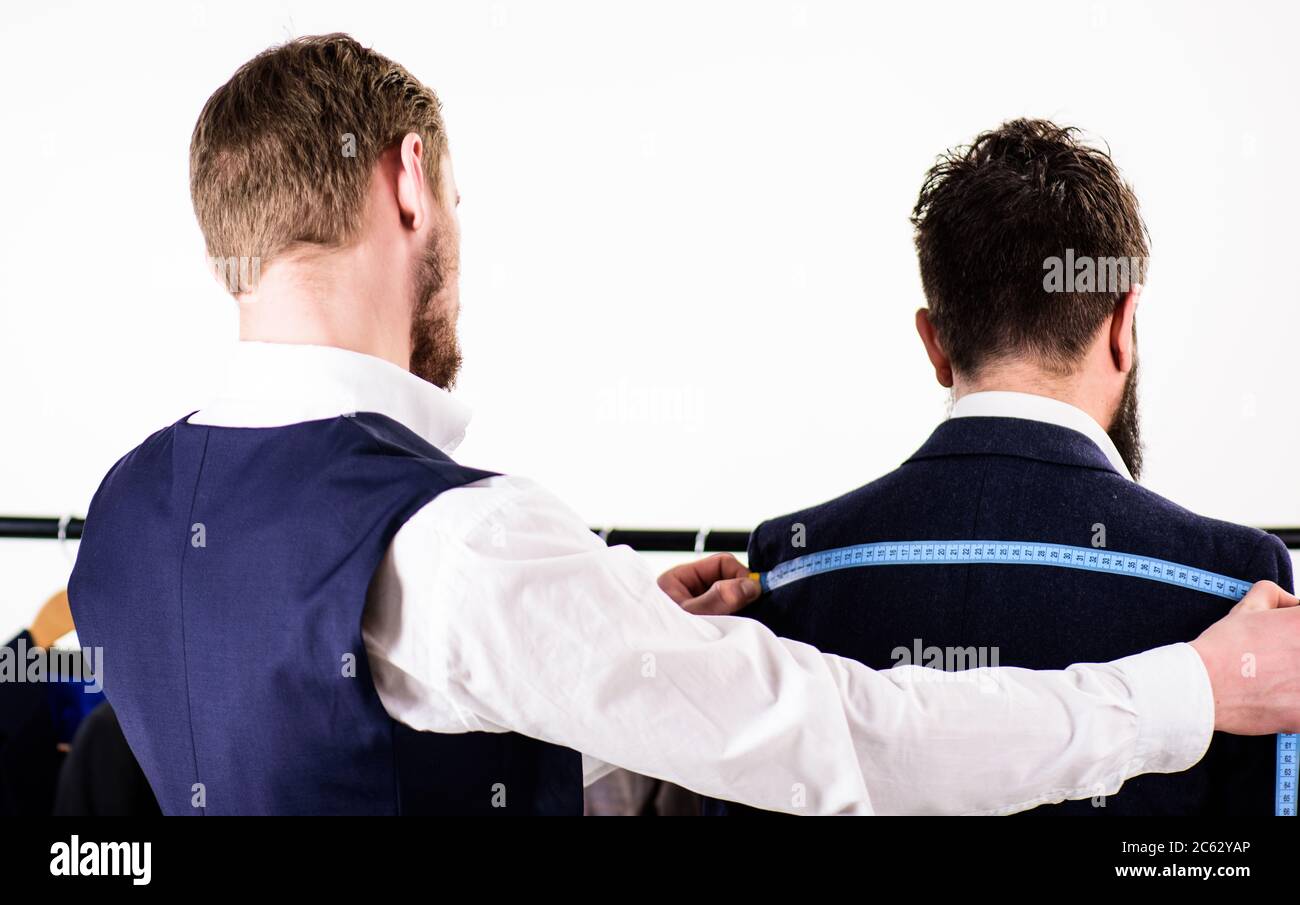 Tailor measure back for sewing suit, white background. Man with ...
