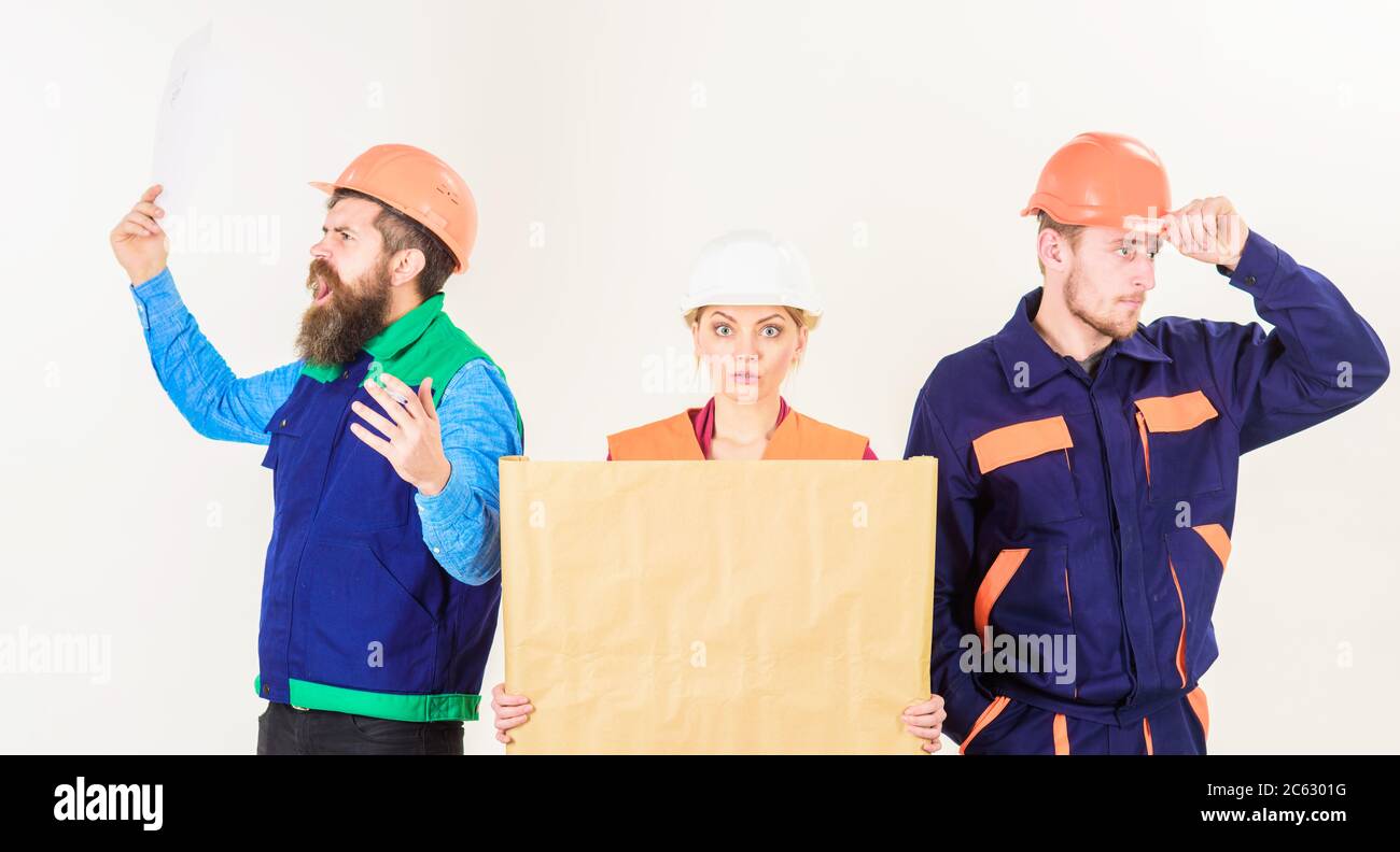 Disagreement concept. Men and woman in helmets, architects on confused ...