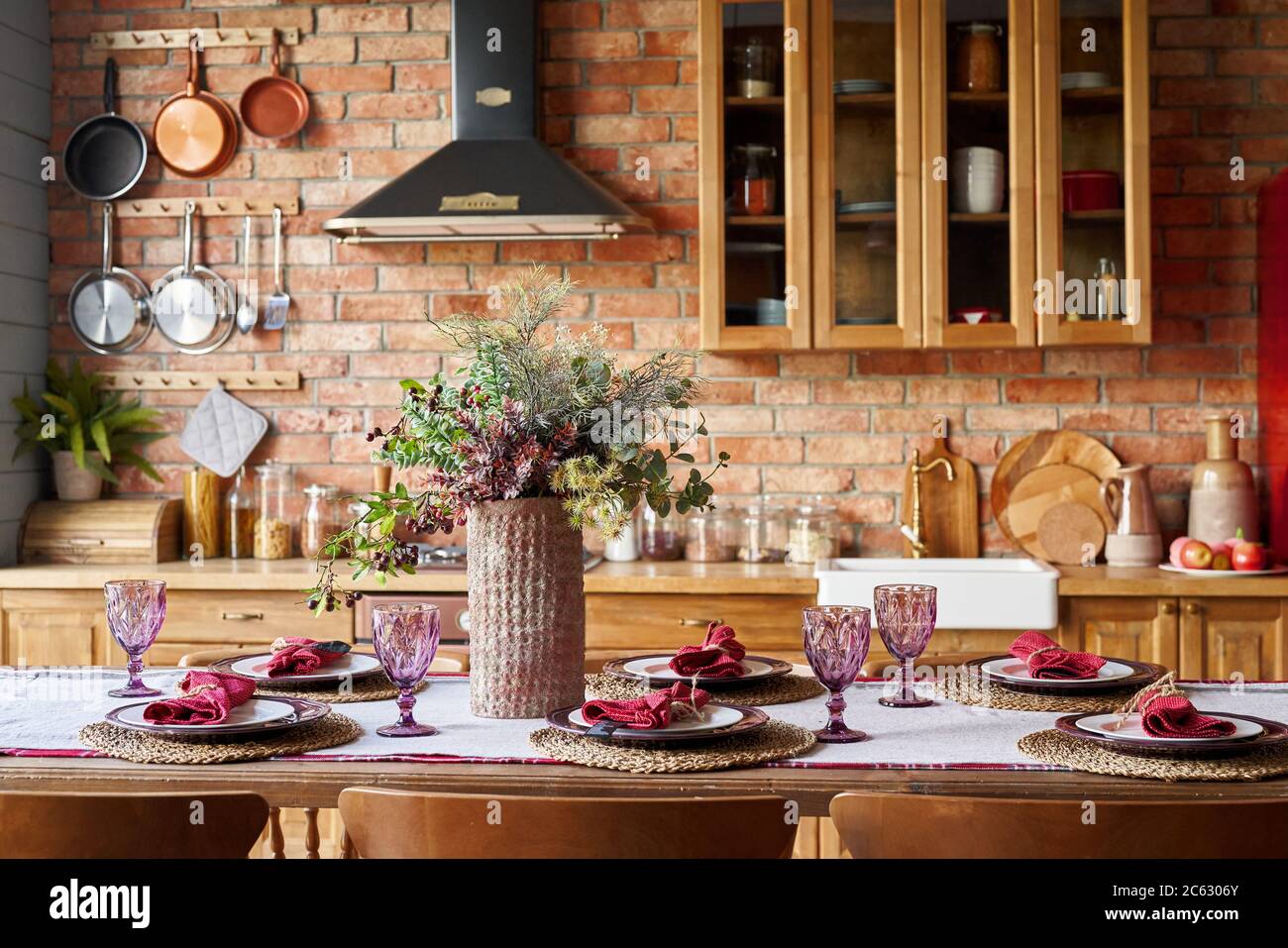 Serving for dinner on kitchen table. Warm kitchen background interior ...