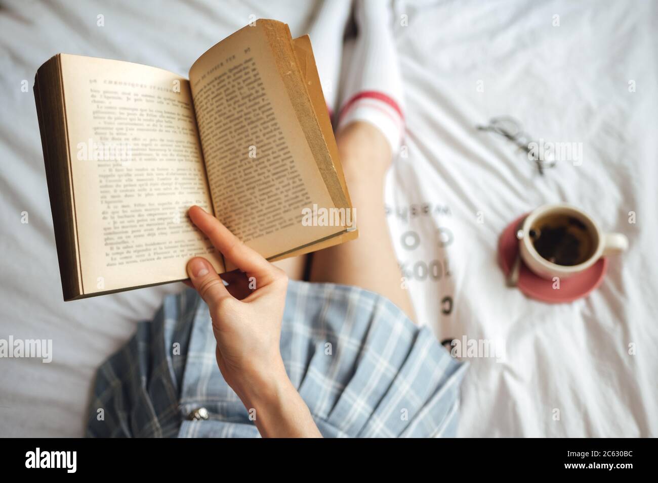 Woman reads a book Stock Photo - Alamy