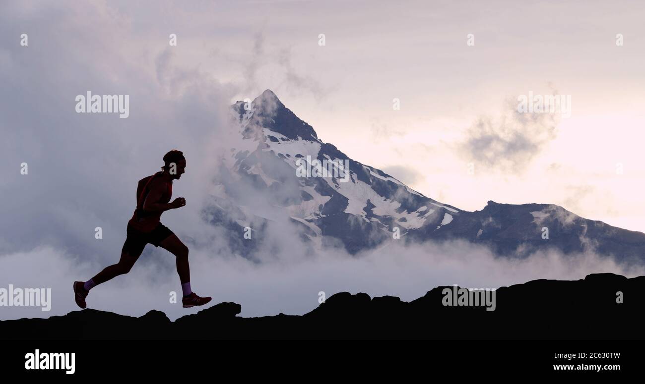 Running man athlete silhouette trail running in mountain summit ...