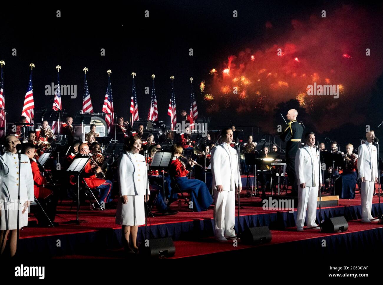 Fireworks explode over the National Mall as the U.S. Marine Band ...