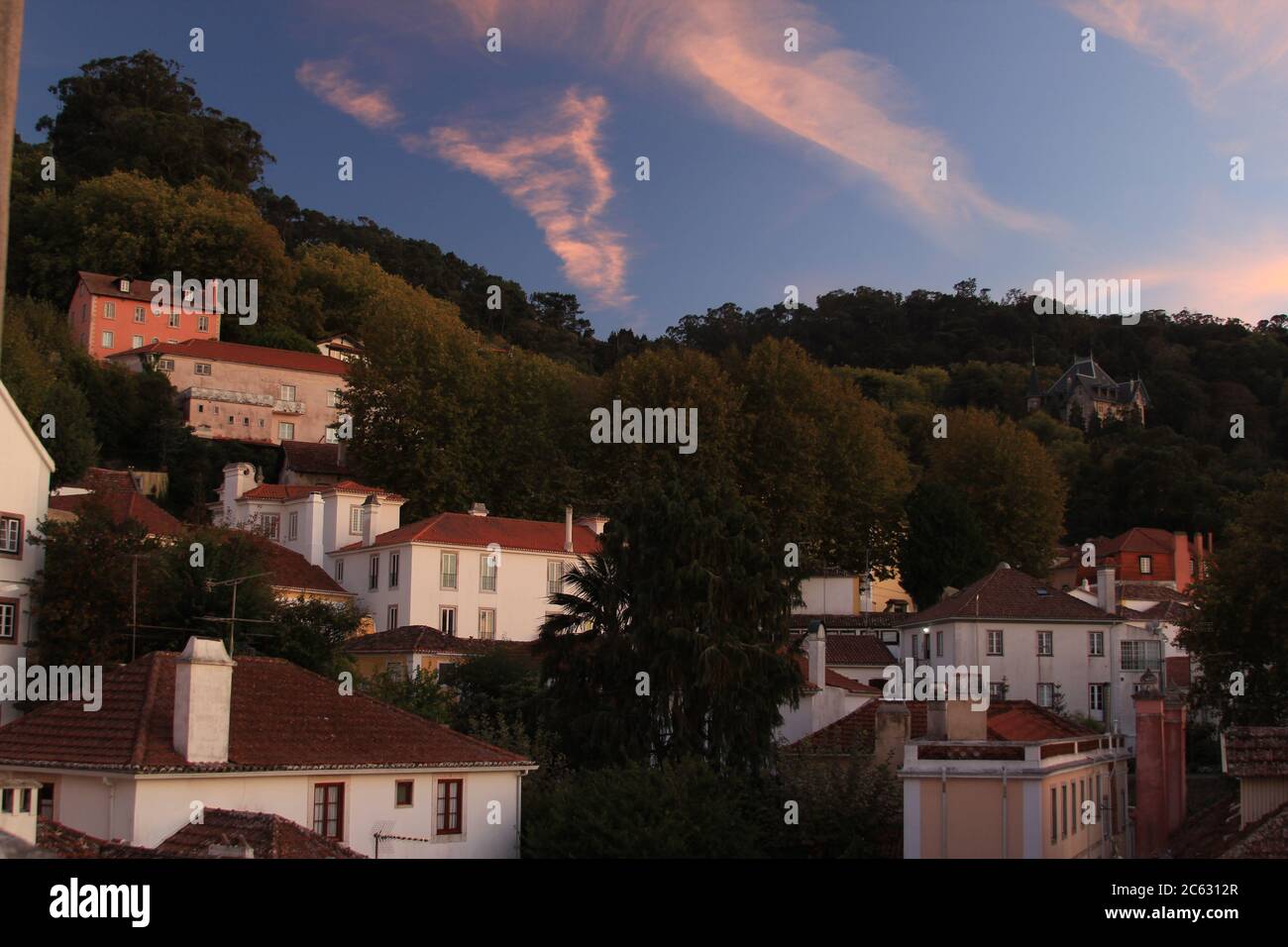 Sunset in Sintra in Portugal. Blue sky with pink clouds and roofs of ...
